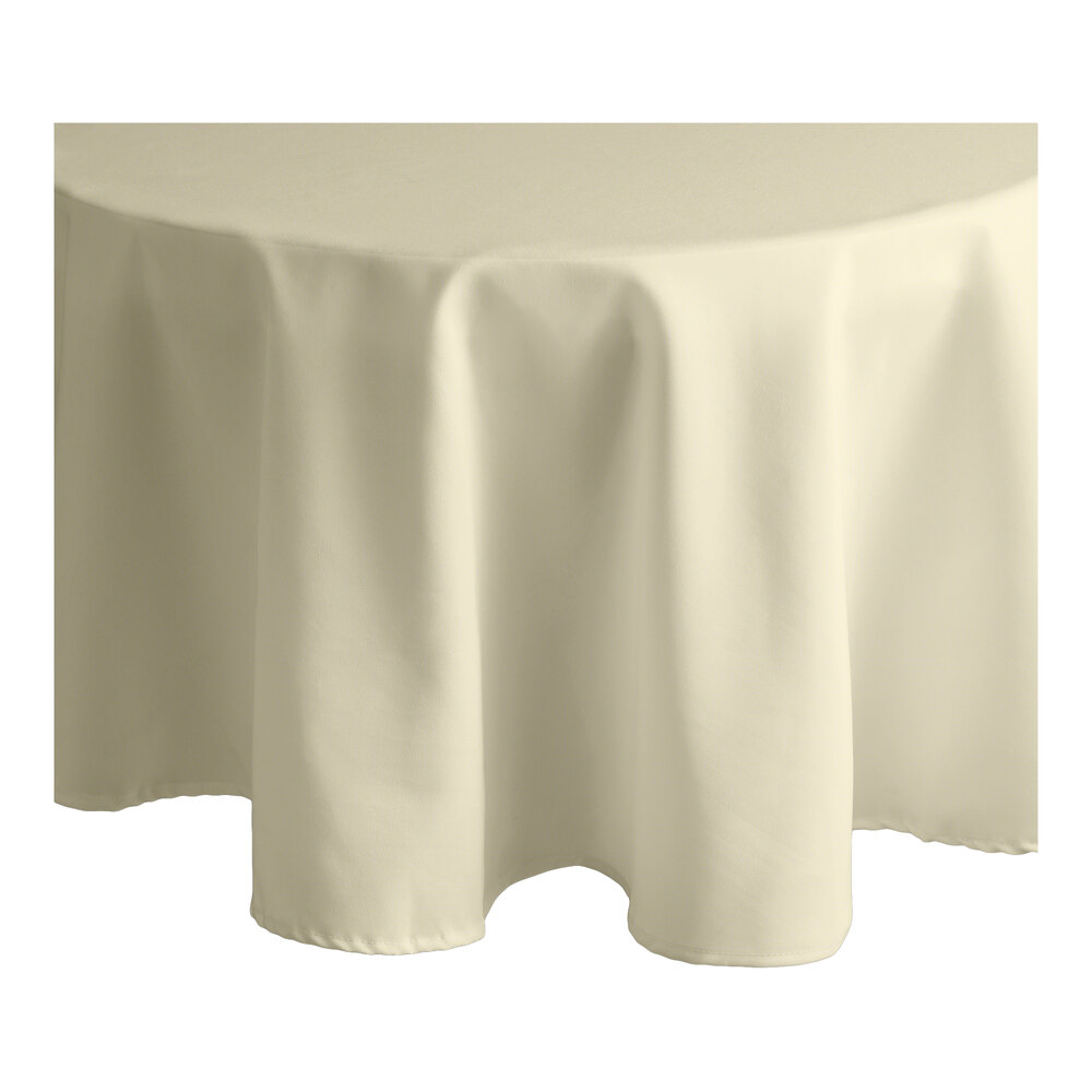 Intedge 72" Round Ivory Seamed 100% Polyester Hemmed Cloth Table Cover