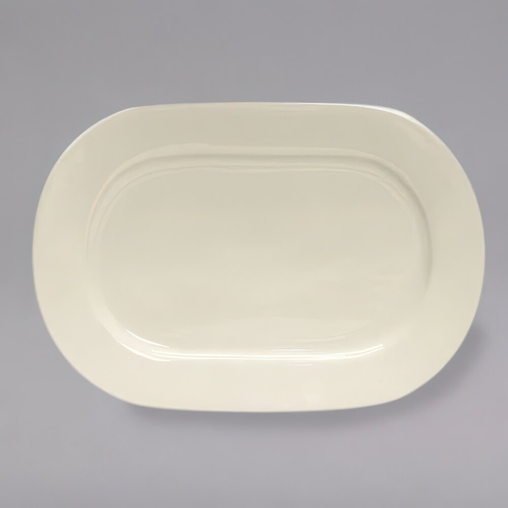 Tuxton BEH-131D Daytona 13 1/8" x 9 1/8" Eggshell Oval China Platter - 12/Case