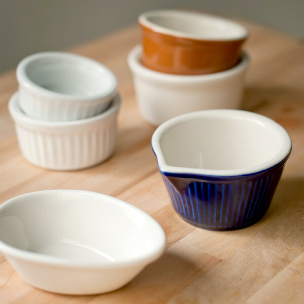 Tuxton BEX-025A 2.5 oz. Eggshell China Teardrop Ramekin - 48/Case