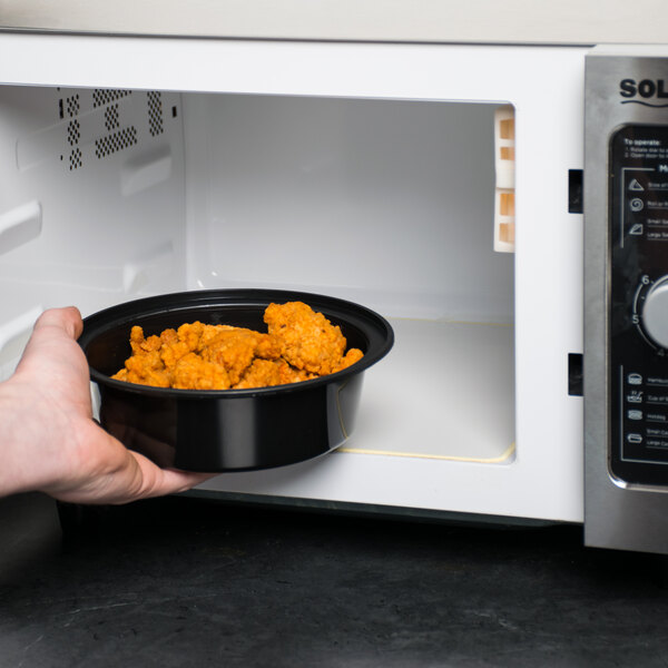 Pactiv Newspring NC729B 32 oz. Black 7" VERSAtainer Round Microwavable ...