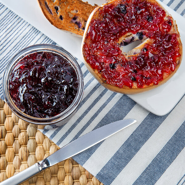 Spreading Grape Jelly On Bread