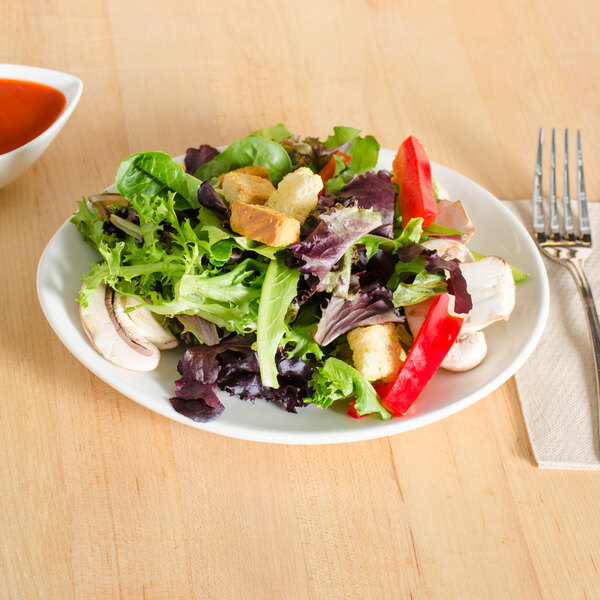 Tuxton BEZ-084P 8 1/2" x 6 7/8" Eggshell Ellipse China Plate - 24/Case