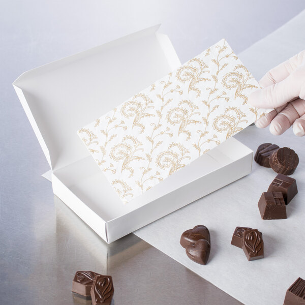 7 3/8" x 3 7/8" 3-Ply Glassine 1/2 lb. White Candy Box Pad with Gold ...