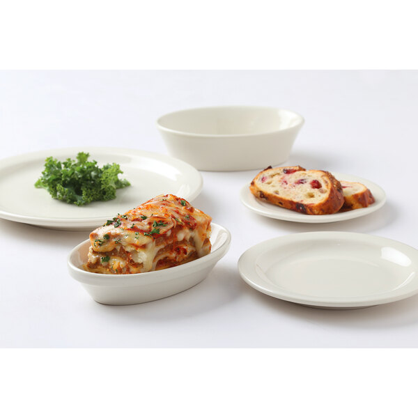 Tuxton BEK-0803 8 oz. Eggshell Oval China Nesting Baker - 12/Case