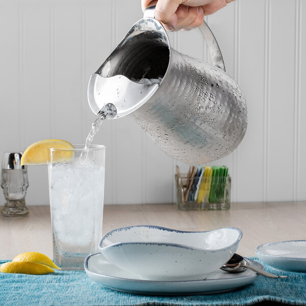 Acopa 64 oz. Hammered Stainless Steel Slender Bell Pitcher with Ice Guard