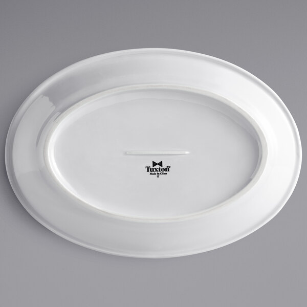 Tuxton CWH-1352 Concentrix 13 1/2" x 9 3/4" White Oval China Coupe Platter - 6/Case