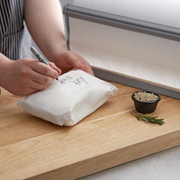 Choice 24" x 700' 40 lb. Premium White True Butcher Paper Roll