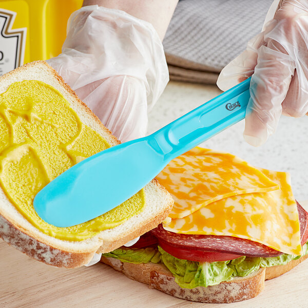 Choice 7 3/4" Smooth Polypropylene Sandwich Spreader with Neon Blue Handle