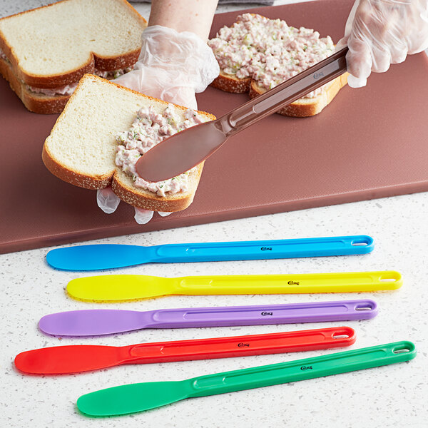 Choice 11 1/2" Smooth Polypropylene Sandwich Spreader with Brown Handle