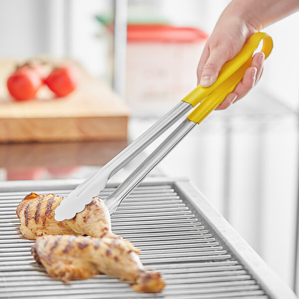 Choice 16" Yellow Coated Handle Stainless Steel Scalloped Tongs