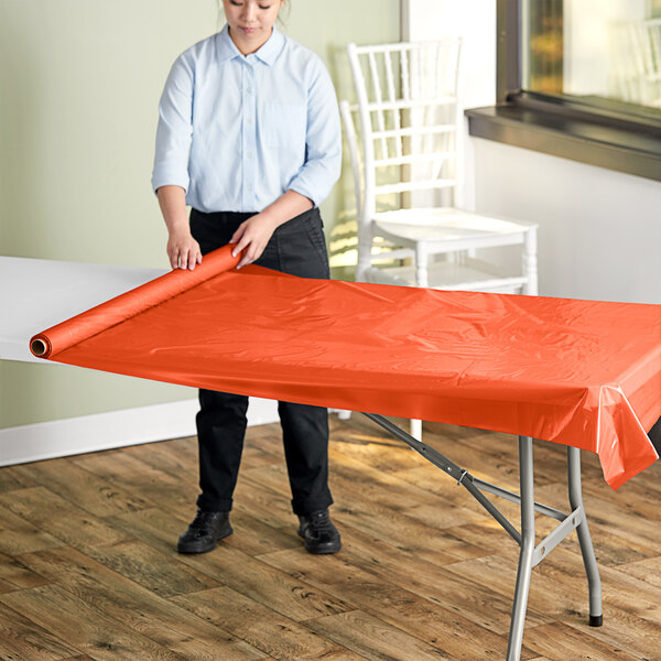 Table Mate 40" x 100' Tangerine Plastic Table Cover Roll - 4/Case