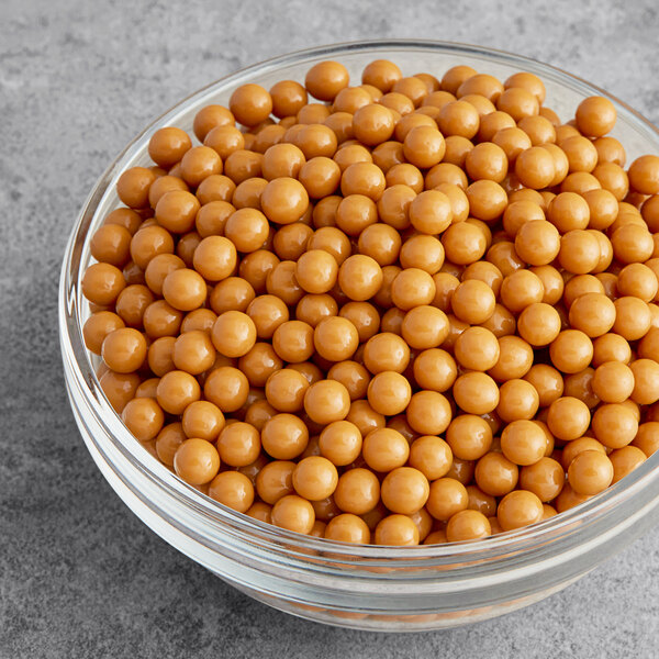 Valrhona Dulcey 35% Blond Chocolate Crunchy Pearls 6.6 lb. - 3/Case