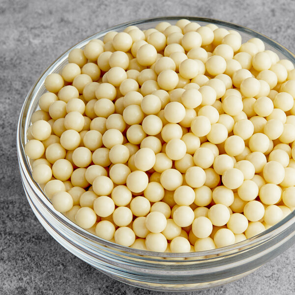 Valrhona Opalys 34% White Chocolate Crunchy Pearls 6.6 lb. - 3/Case