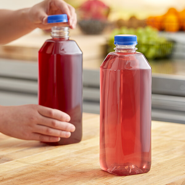 32 oz. Square PET Clear Juice Bottle with Blue Lid - 104/Case