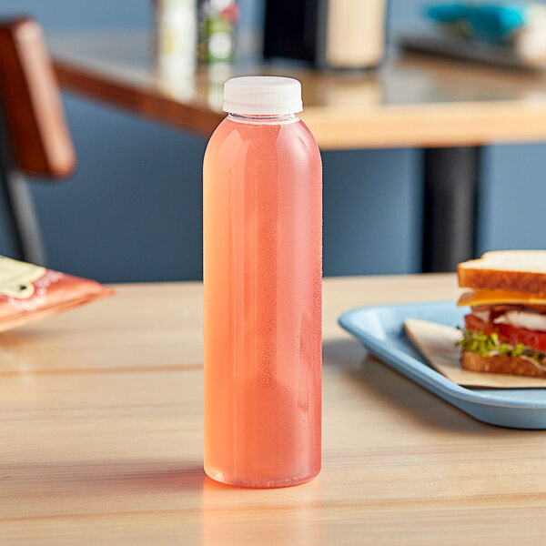 16 oz. Round PET Clear Juice Bottle with Clear Lid - 186/Case