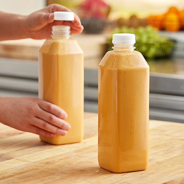 32 oz. Square PET Clear Juice Bottle with White Lid - 104/Case