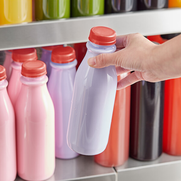 16 oz. Round PET Clear Carafe Juice Bottle with Red Lid - 145/Case