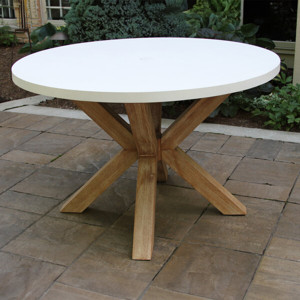 Outdoor Interiors 48" Round Ivory Composite and Eucalyptus Dining Table