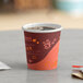 Choice 4 oz. Coffee Print Poly Paper Hot Cup - 50/Pack