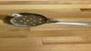 Choice 2 oz. Red Perforated Portion Spoon